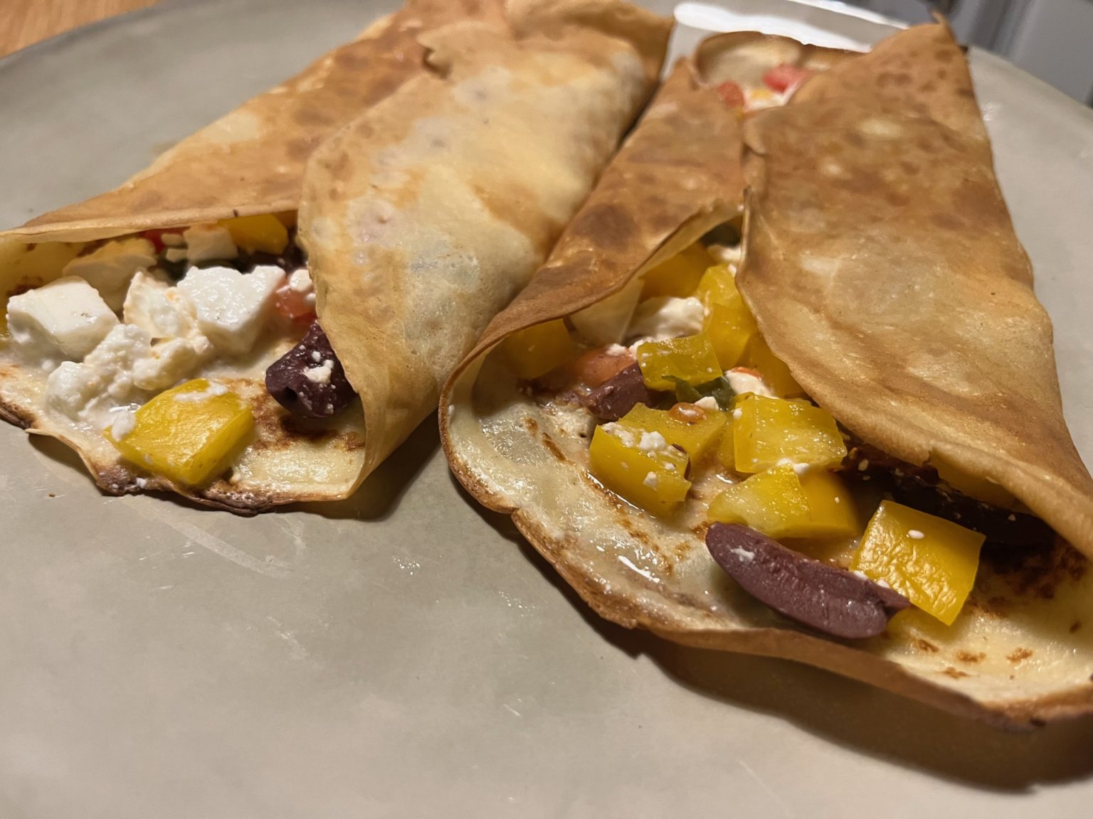 Crepes with feta cheese, tomatoes and olives - Poupadou